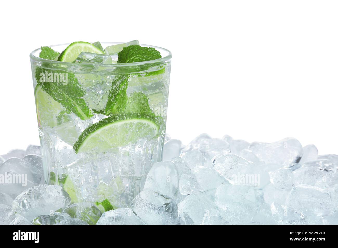 Ice cubes and delicious cocktail on white background Stock Photo - Alamy