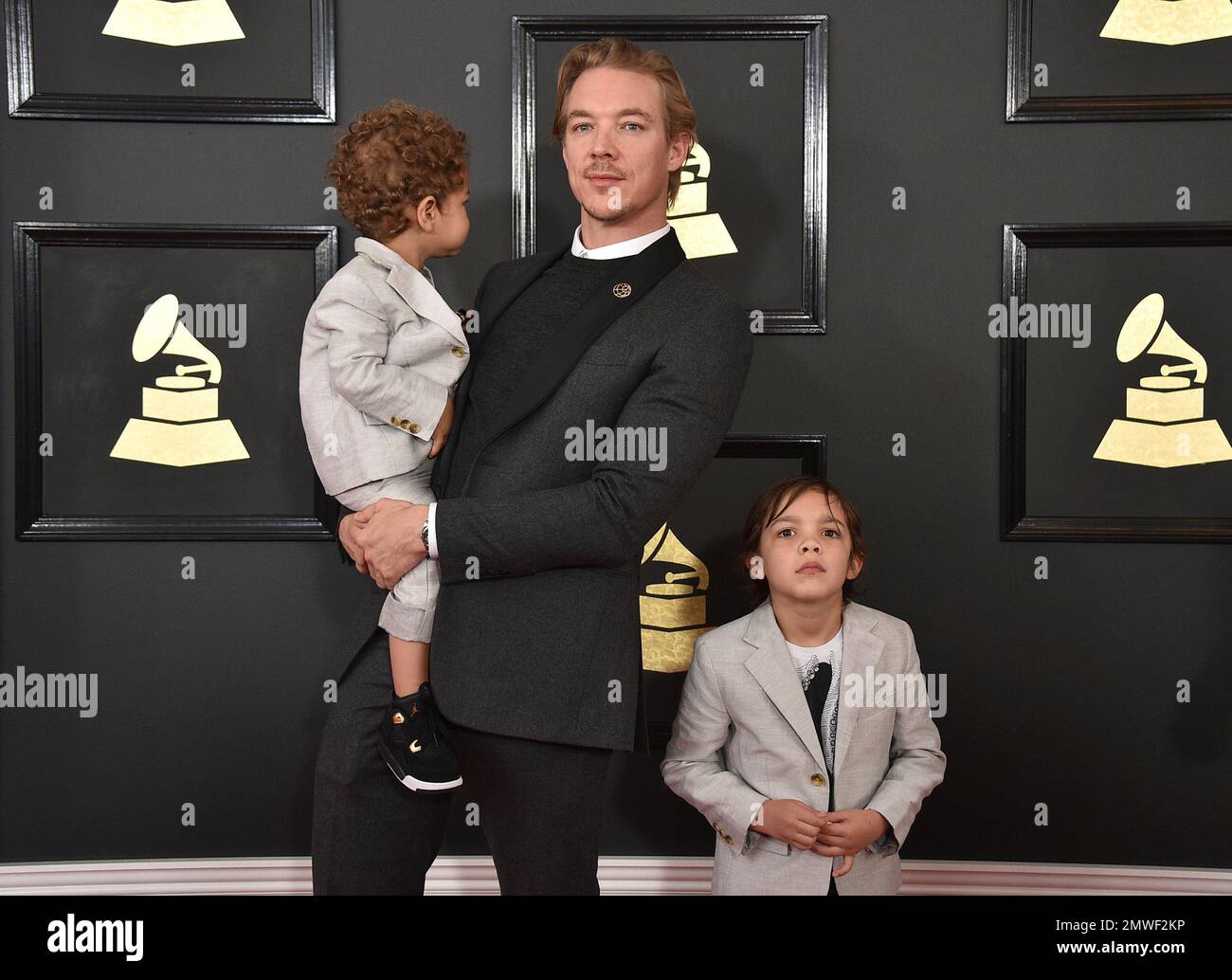 Diplo, center, with Lazer Pentz, left, and Lockett Pentz, right, arrive ...