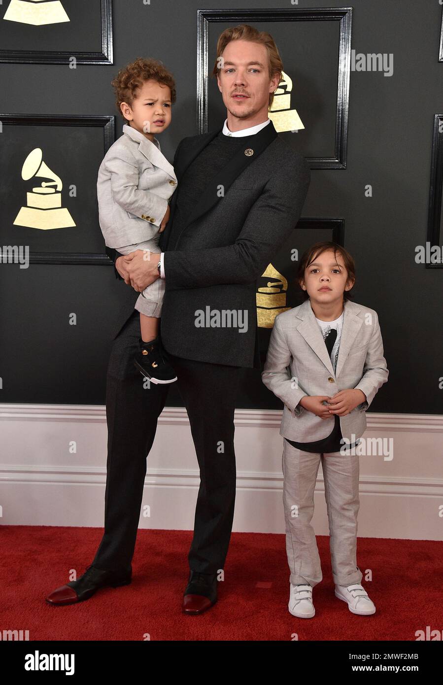 Diplo, center, with Lazer Pentz, left, and Lockett Pentz, right, arrive ...