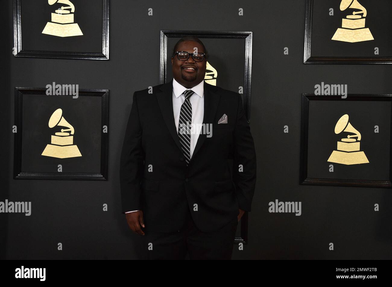Jason Boyd, aka Poo Bear, arrives at the 59th annual Grammy Awards at ...