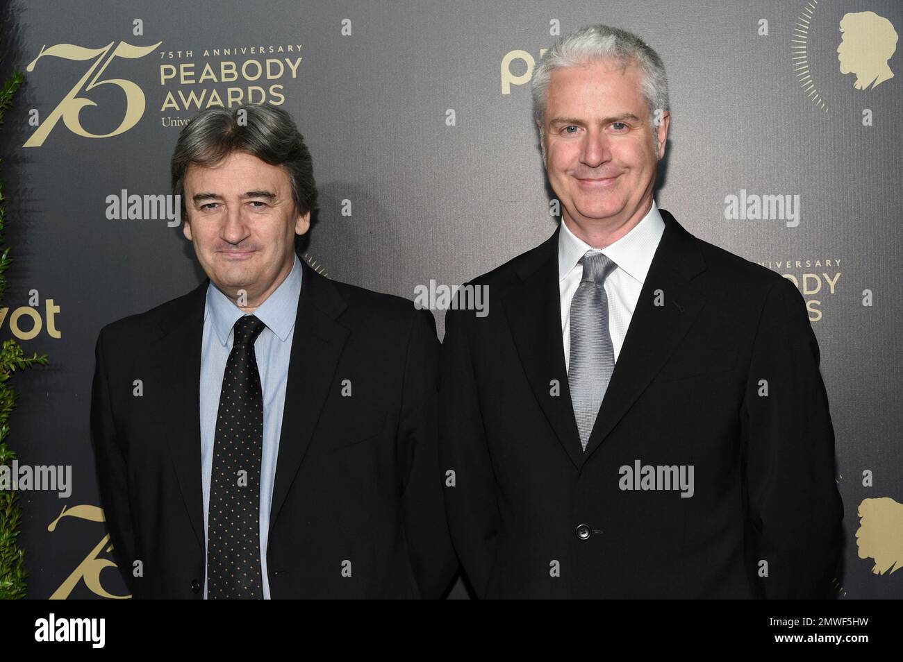 BBC journalists Fergal Keane, left, Robert Magee attends the 75th ...