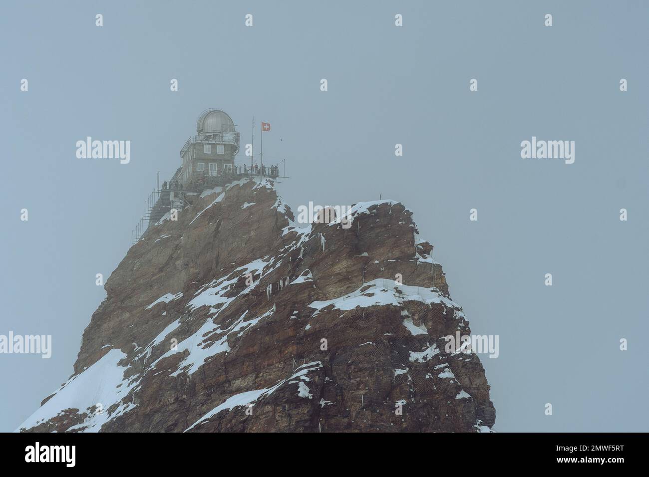 The Sphinx astronomical Observatory, above the foggy Jungfraujoch in ...
