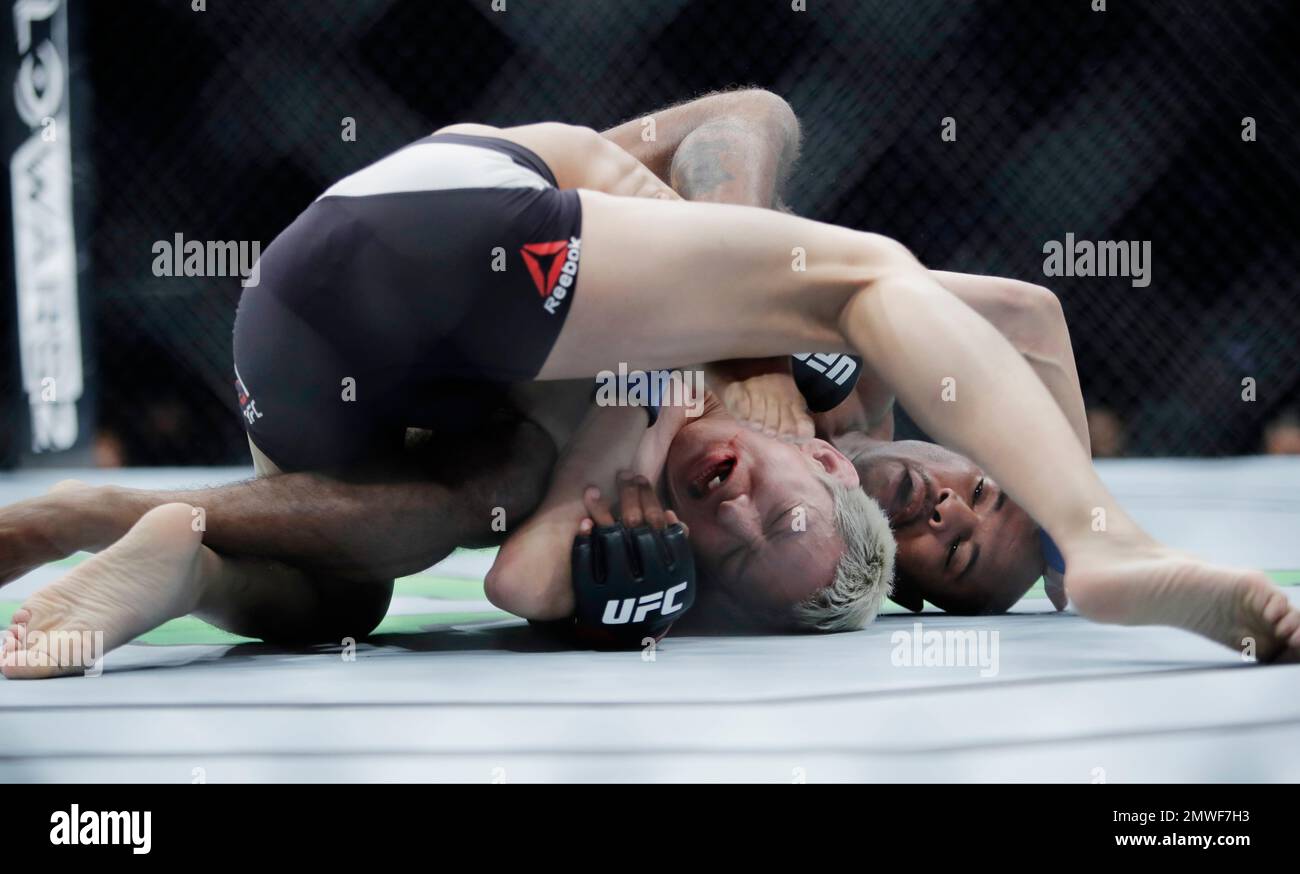 Wilson Reis, of Brazil, right, works against Ulka Sasaki, of Japan ...