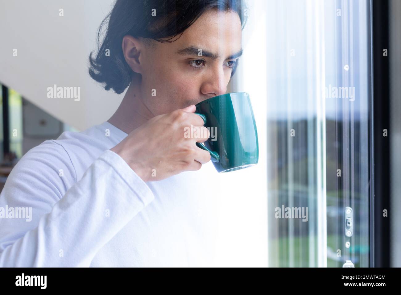 Man through window holding hi-res stock photography and images - Alamy