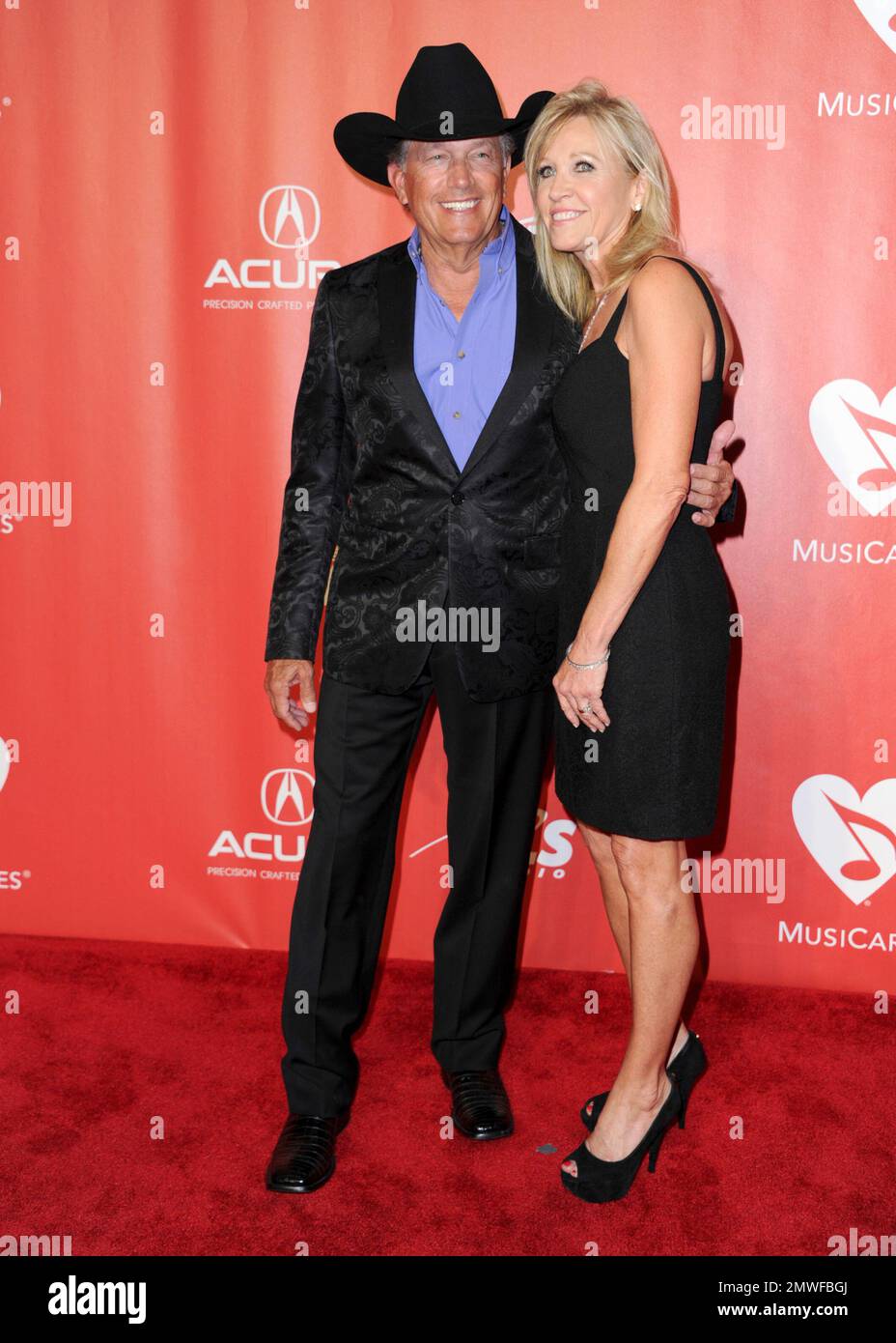 George Strait, left, and Norma Strait arrive at the MusiCares Person of ...