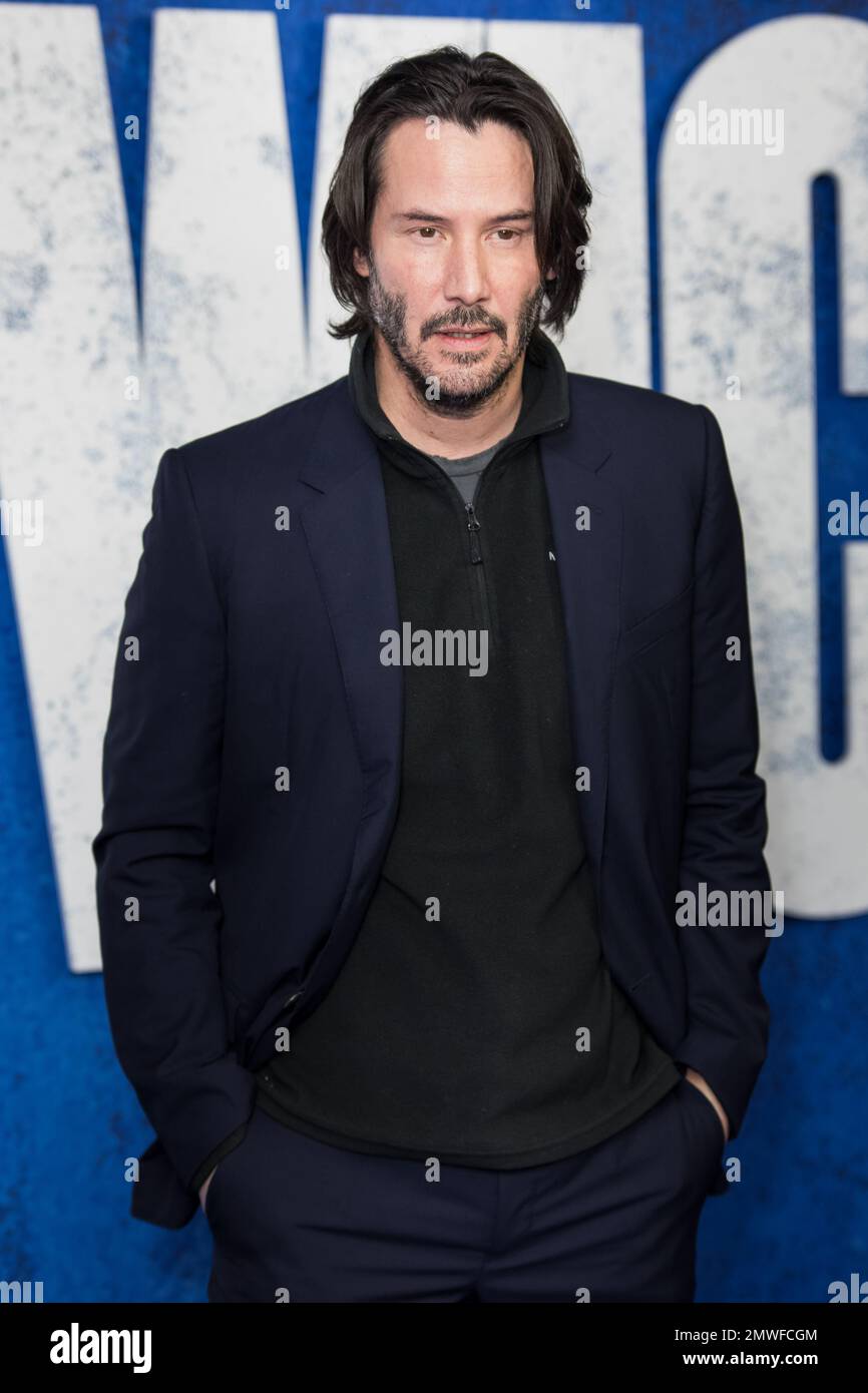 Actor Keanu Reeves poses for photographers upon arrival at the ...