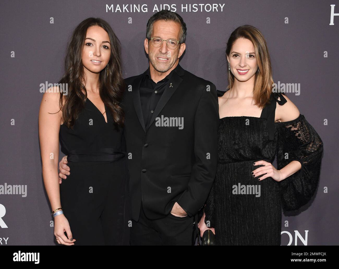 Kenneth Cole and daughters Katie, left, and Emily attend amfAR's ...