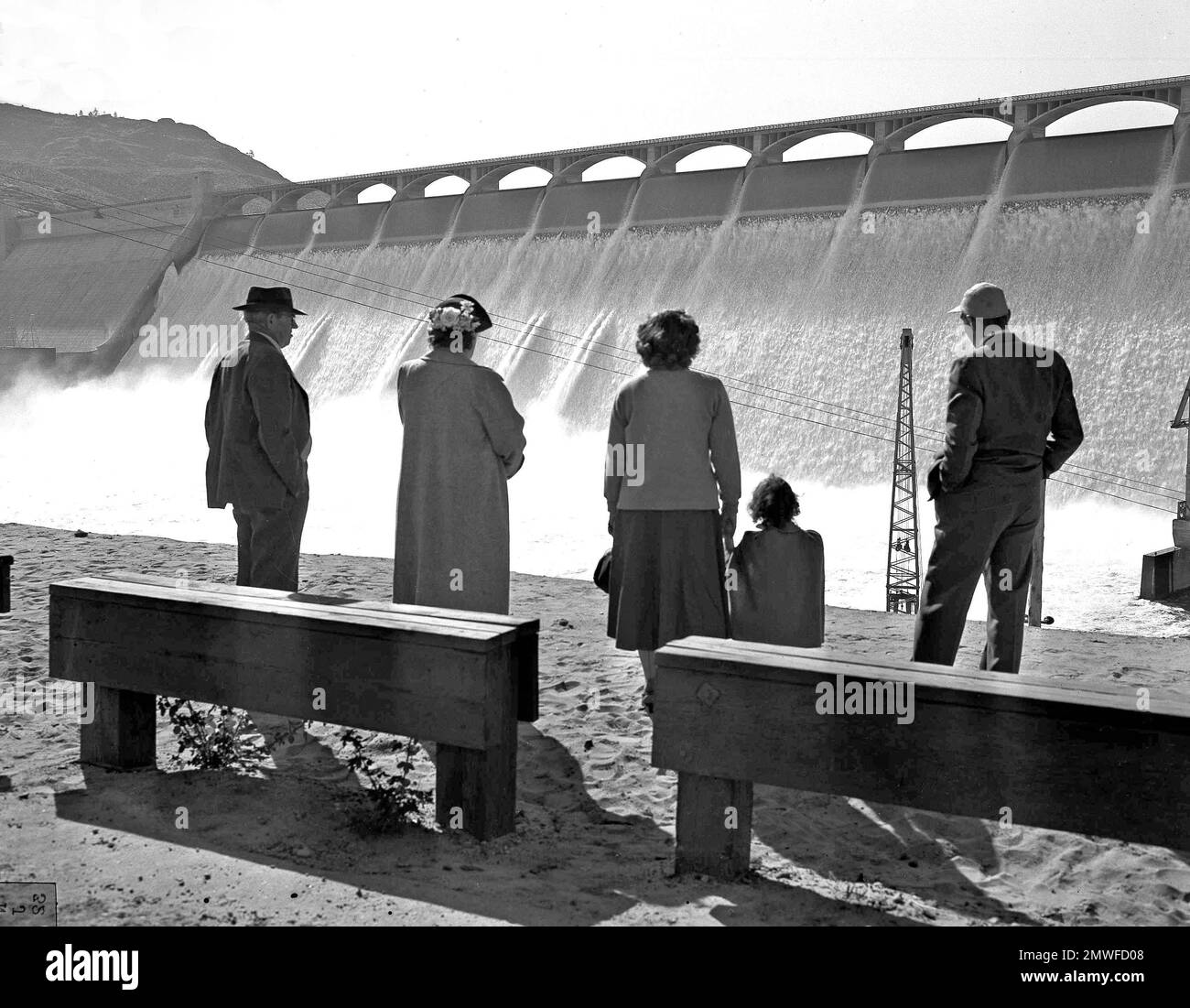 Early arriving visitors look at the giant Coulee Dam spillway a few ...