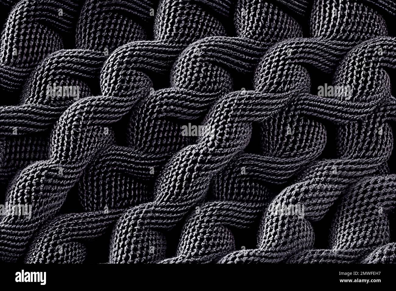 Black knitted fabric surface abstract background. Decorative knitwear ...
