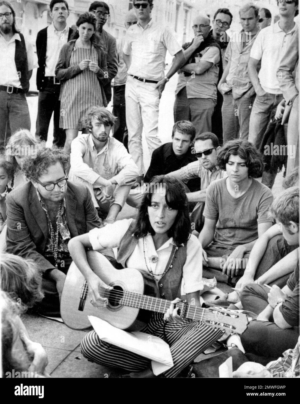 FILE - In this Sept. 22, 1967, file photo, folk singer Joan Baez sits ...
