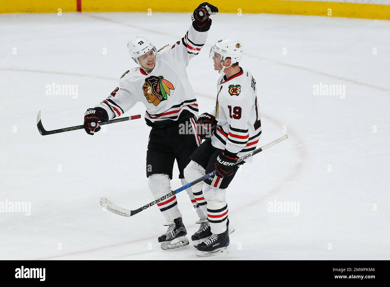 Chicago Blackhawks' Jonathan Toews (19) and Artemi Panarin celebrate ...