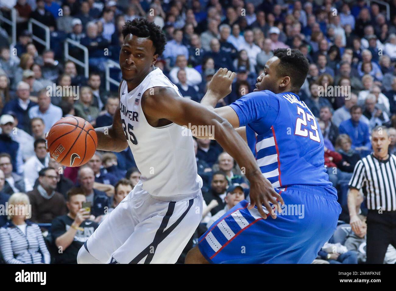 Xavier's RaShid Gaston (35) dribbles around DePaul's Al Eichelberger ...