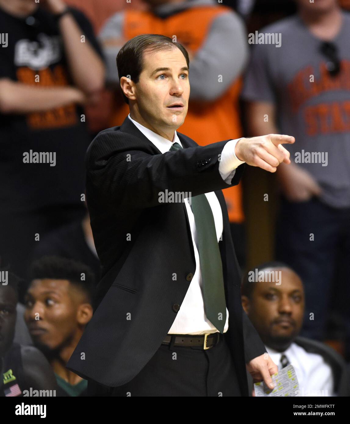 Baylor head coach Scott Drew points to his team during the first half ...