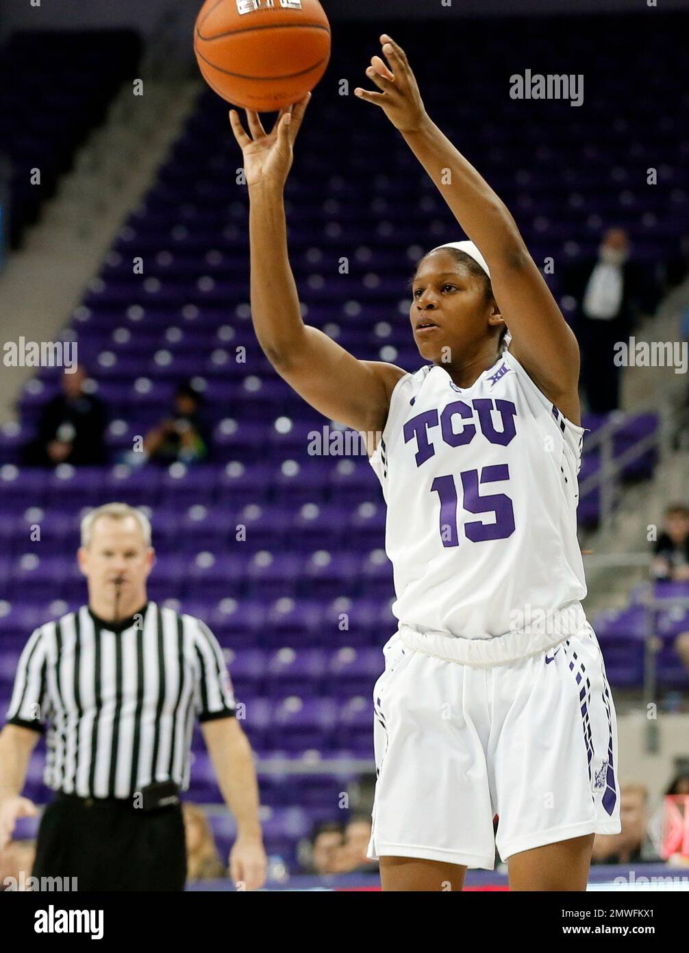TCU forward Jada Butts (15) shoots a three-point basket against Texas ...