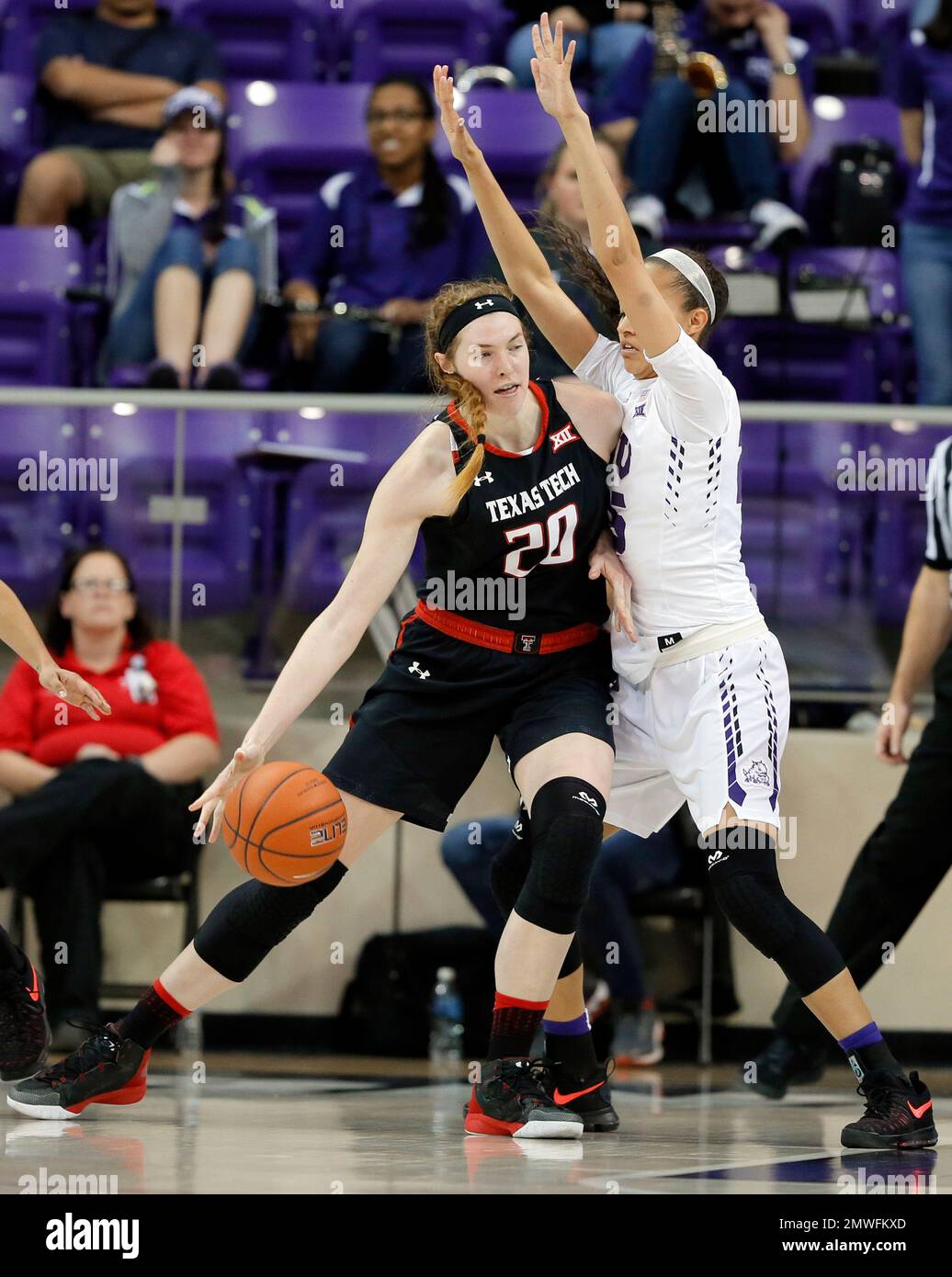 Texas Tech forward Brittany Brewer (20) works against TCU's Kianna Ray ...