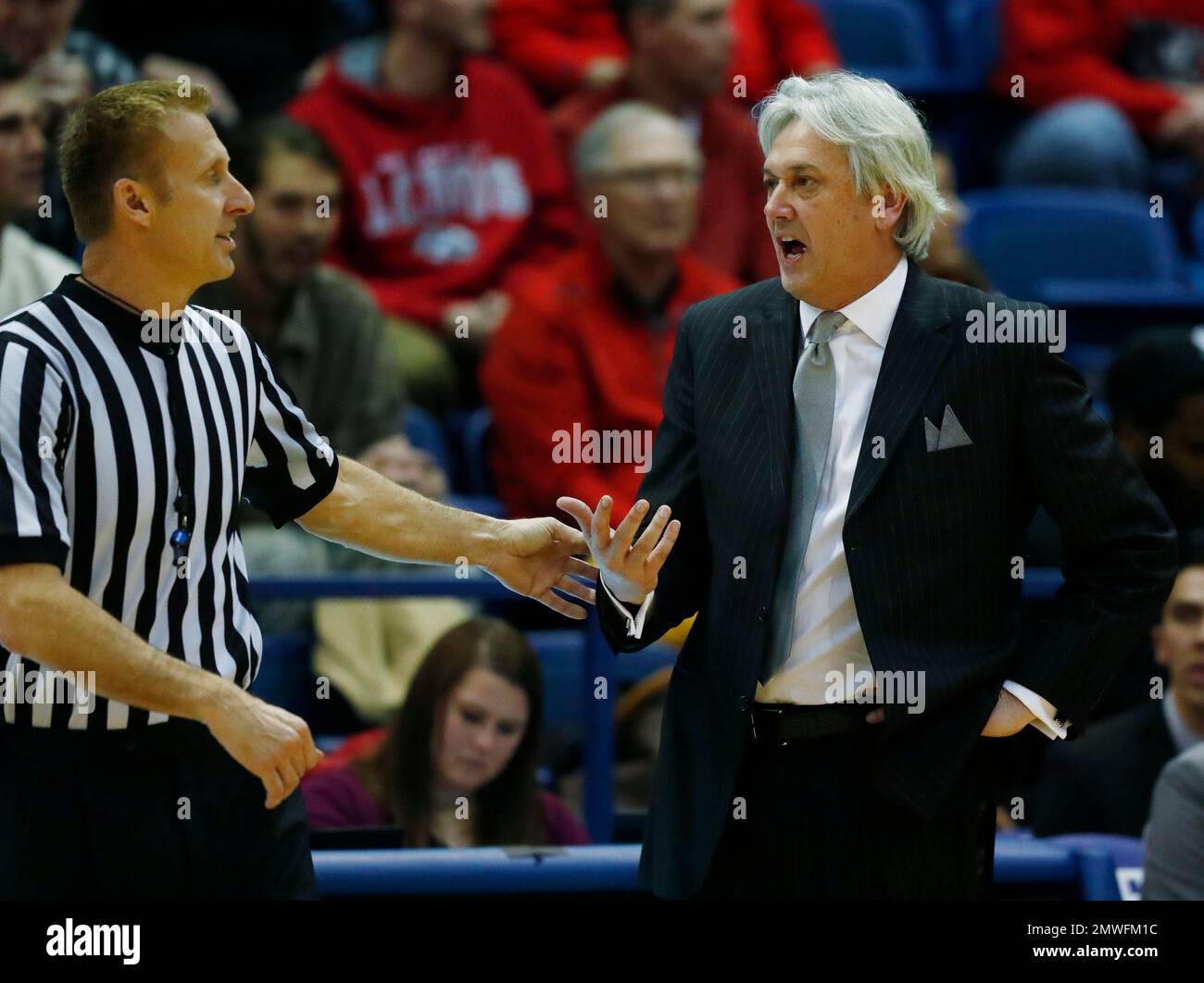 New Mexico head coach Craig Neal, right, argues a call with a referee ...