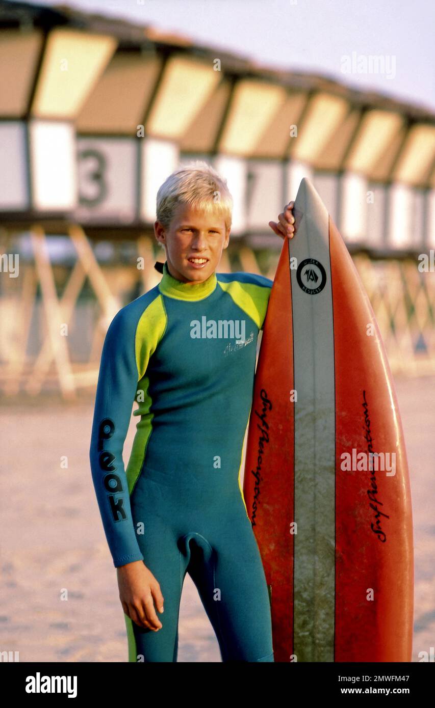 Portrait of a young surfer at Huntington Beach in Orange County, CA ...