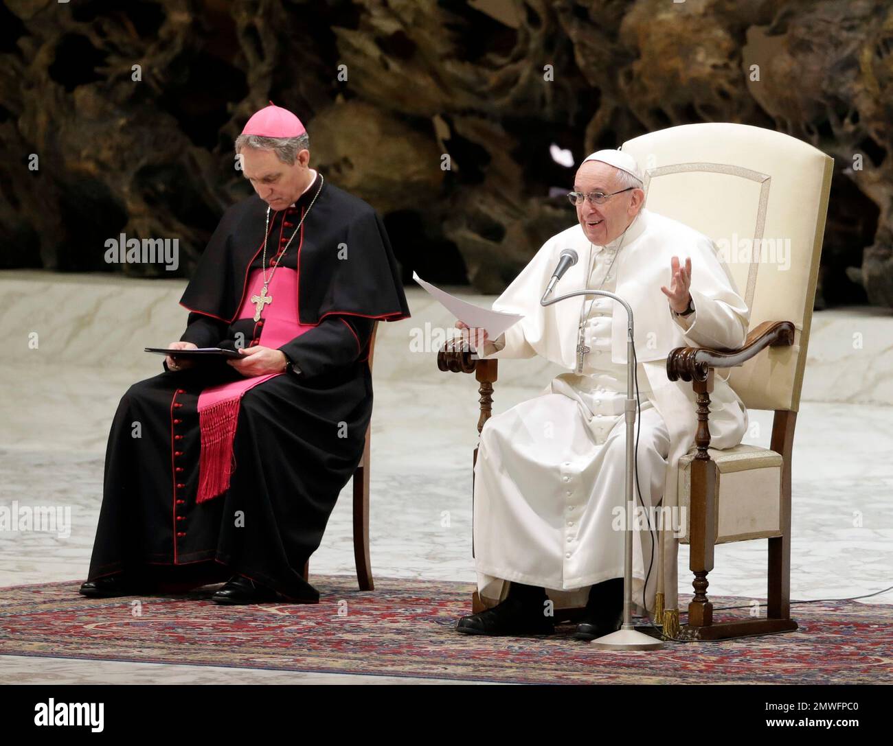 Pope Francis, flanked at left by Archbishop Georg Gaenswein, delivers ...