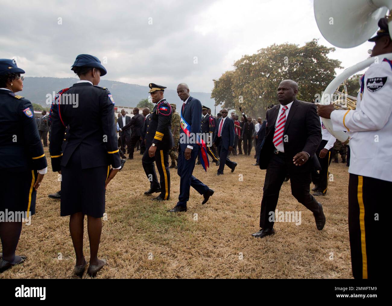 Haiti's President Jovenel Moise walks with Police chief Michel-Ange ...