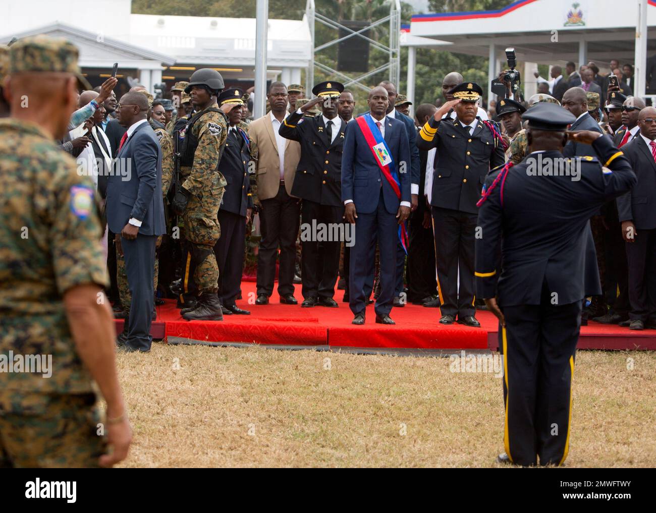 Haiti's President Jovenel Moise stands next to Police Chief Michel-Ange ...