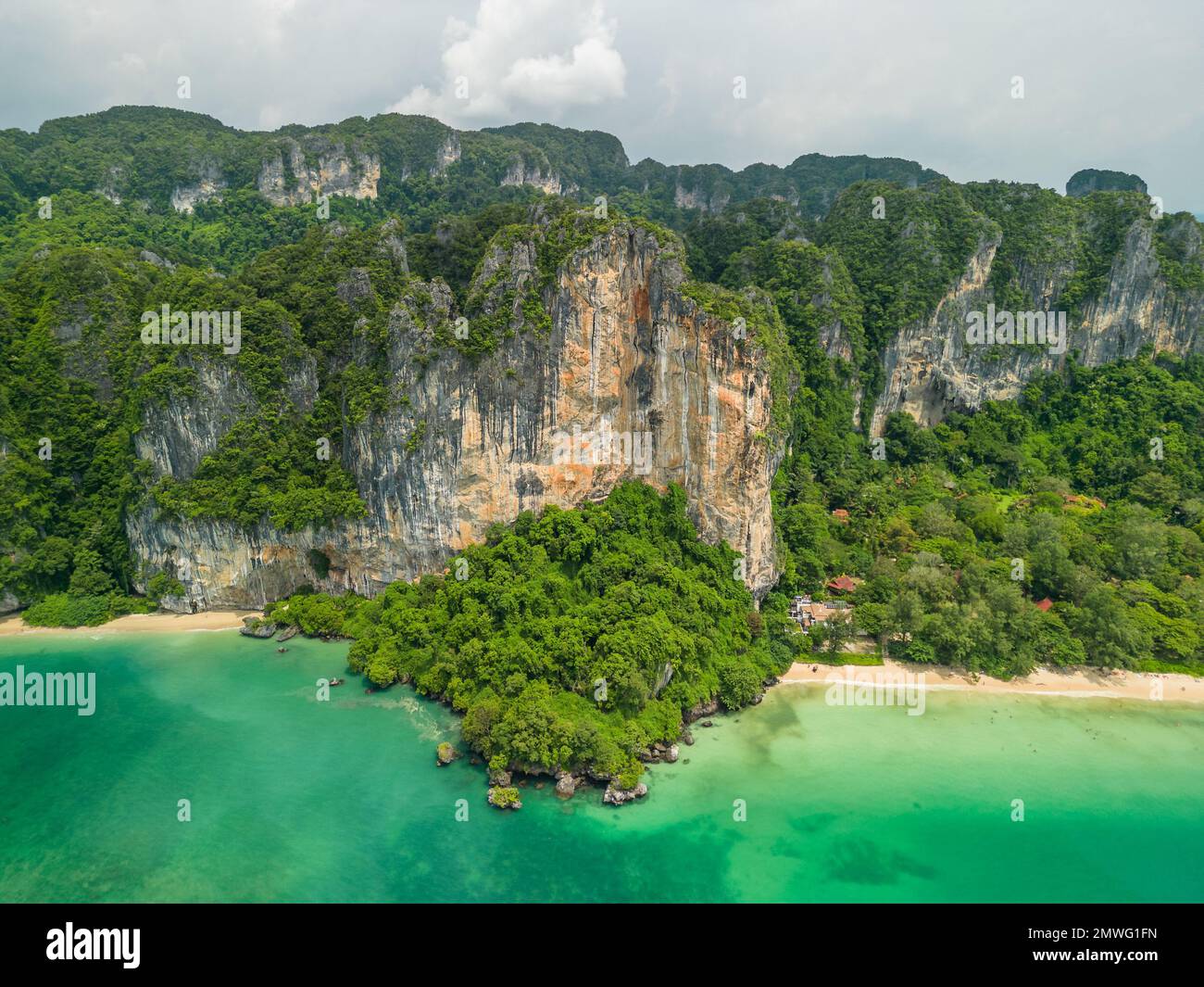 An aerial view of Tropical Sandy Railay Beach with Limestone Cliffs on ...