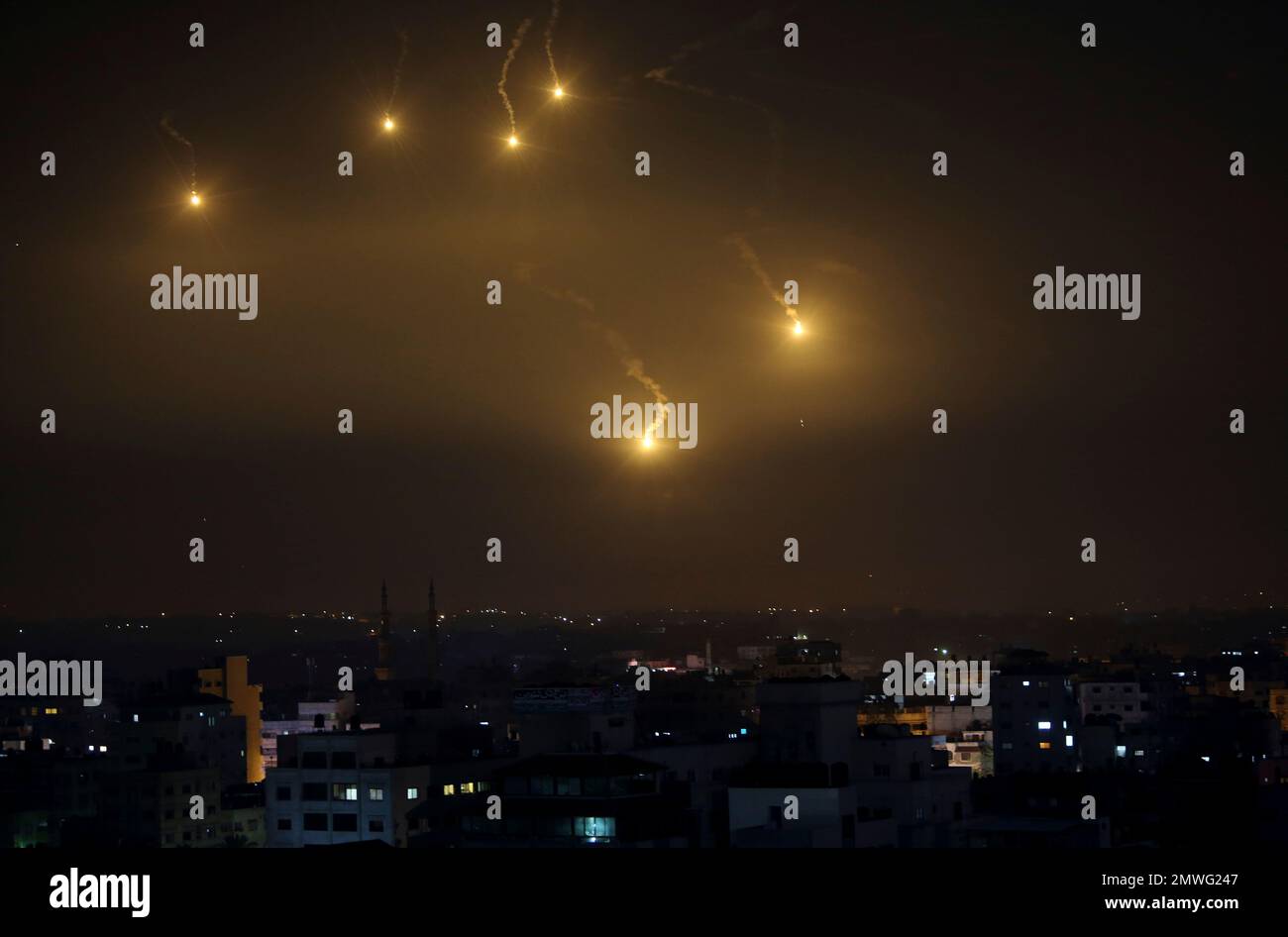 Israeli forces' flares light up the night sky of Gaza City, Monday, Feb ...