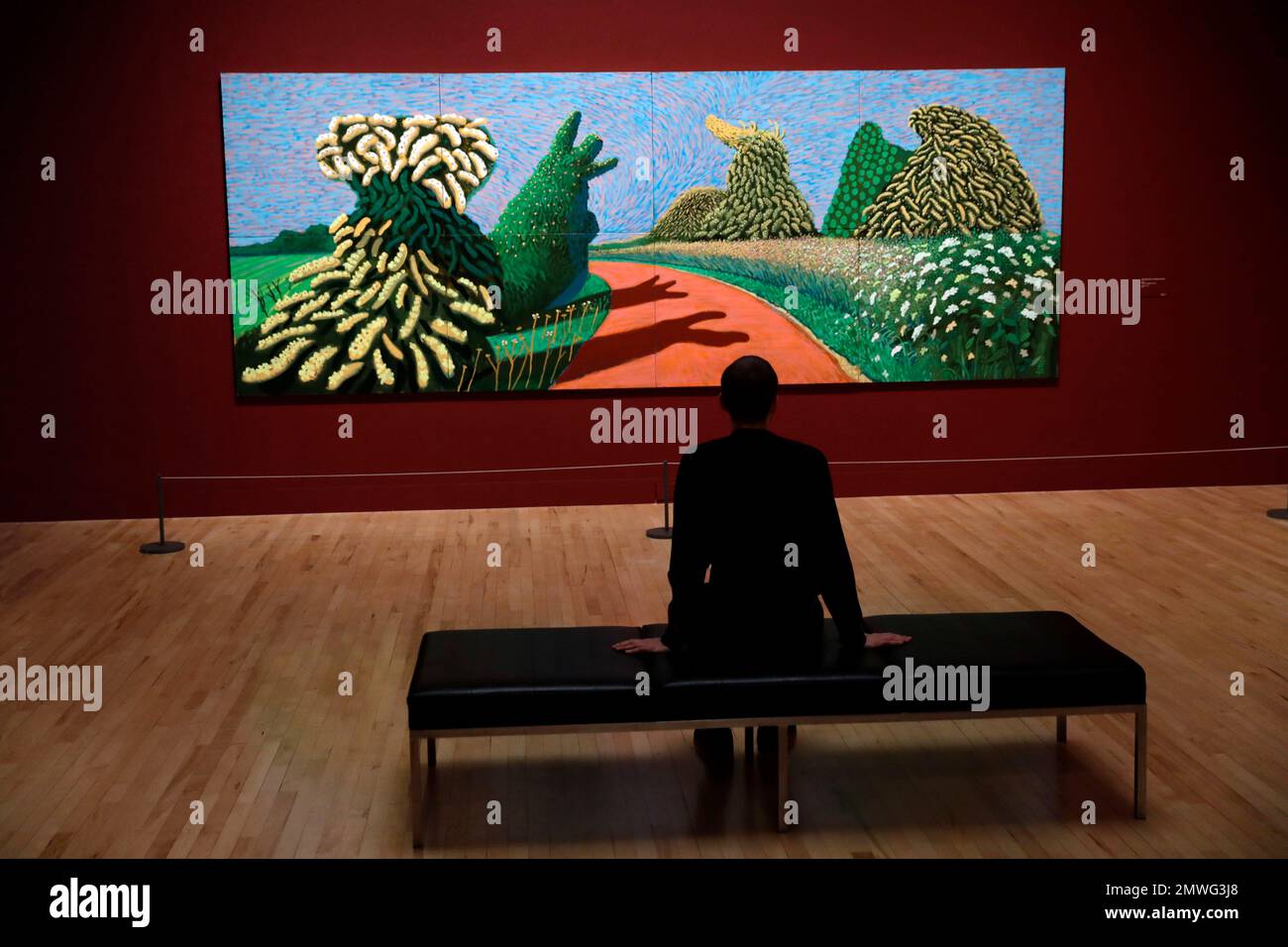 A Tate representative poses for photographs next to British artist ...
