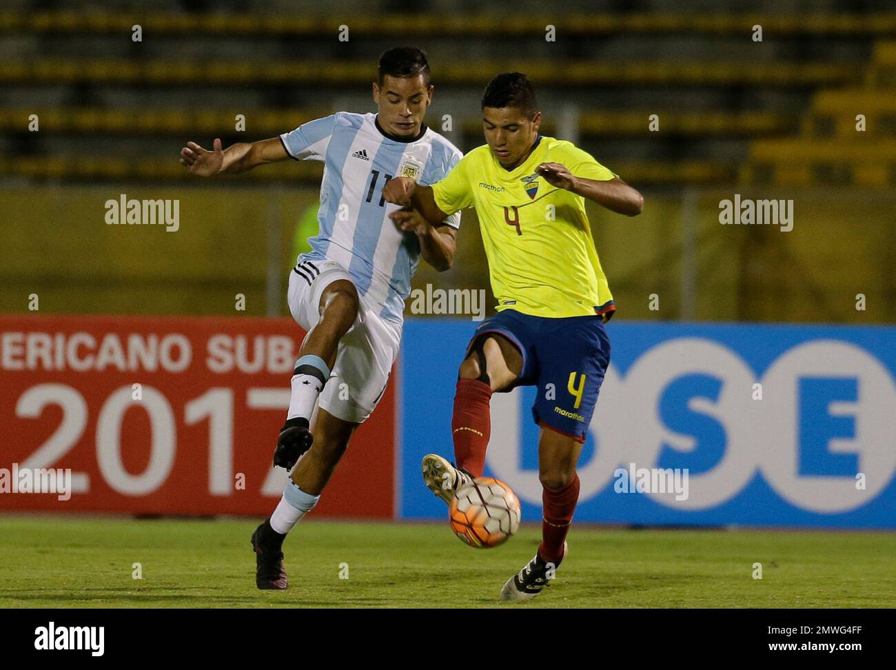 Argentina's Brian Mansilla, left, pressures Ecuador's Kevin Minda ...