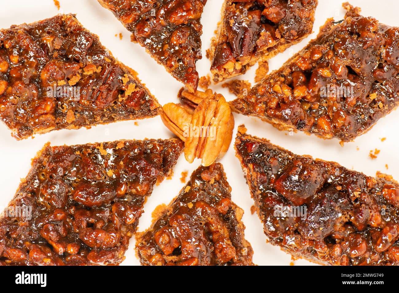 Golden crunchy fresh baked pecan diamond cookies made on a rich short ...