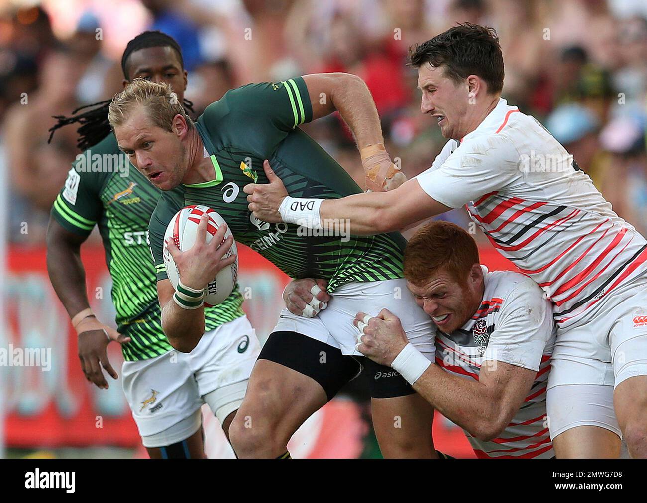England's Alex Davis, right, and James Rodwell tackle South Africa's ...