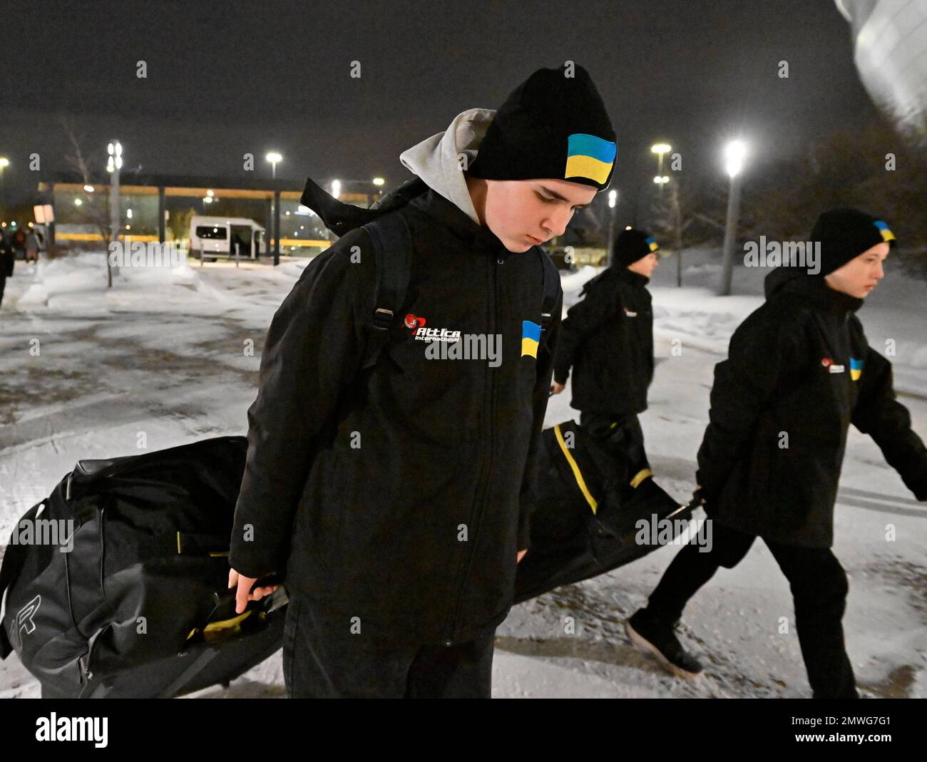 Quebec, Canada, February 1, 2023, Ukrainian peewee hockey players carry ...