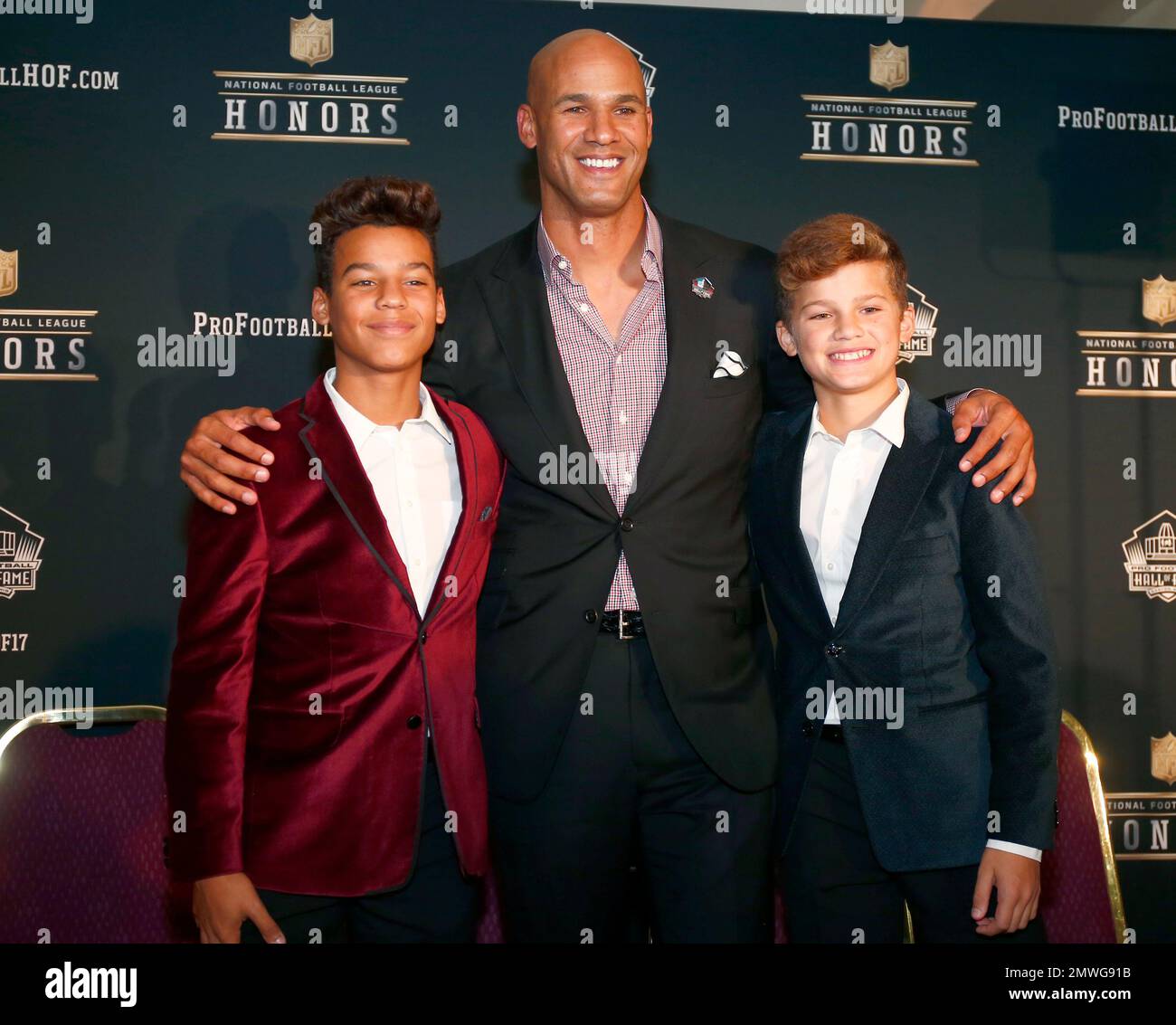 Former NFL player Jason Taylor, center, who will be inducted into the ...