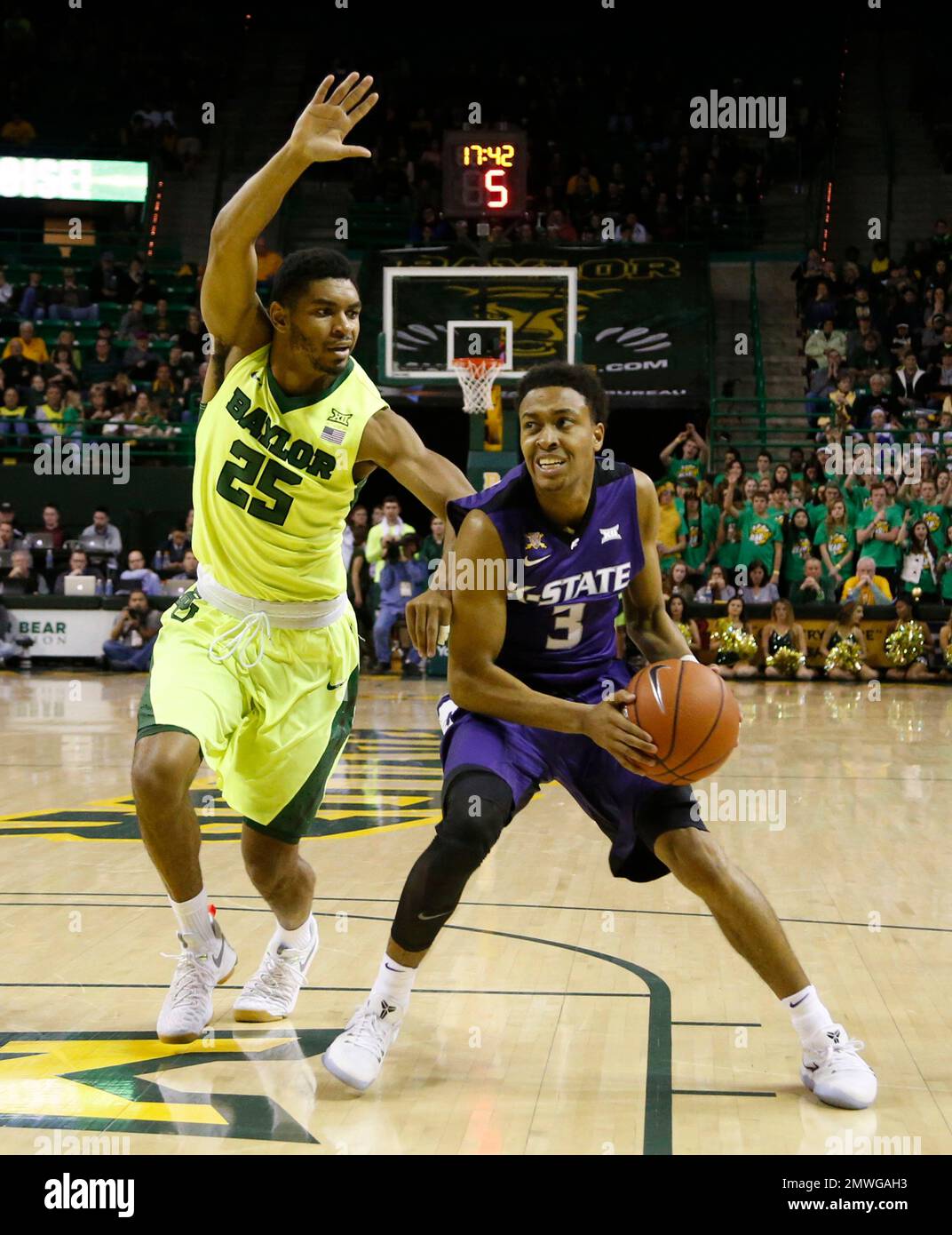 Kansas State guard Kamau Stokes, right, sets up a shot over Baylor ...