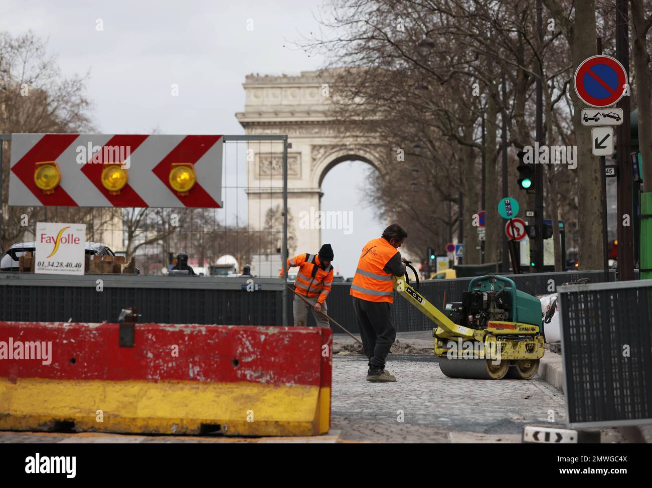 Paris, France. 1st Feb, 2023. Workers are seen near the Arc de Triomphe ...