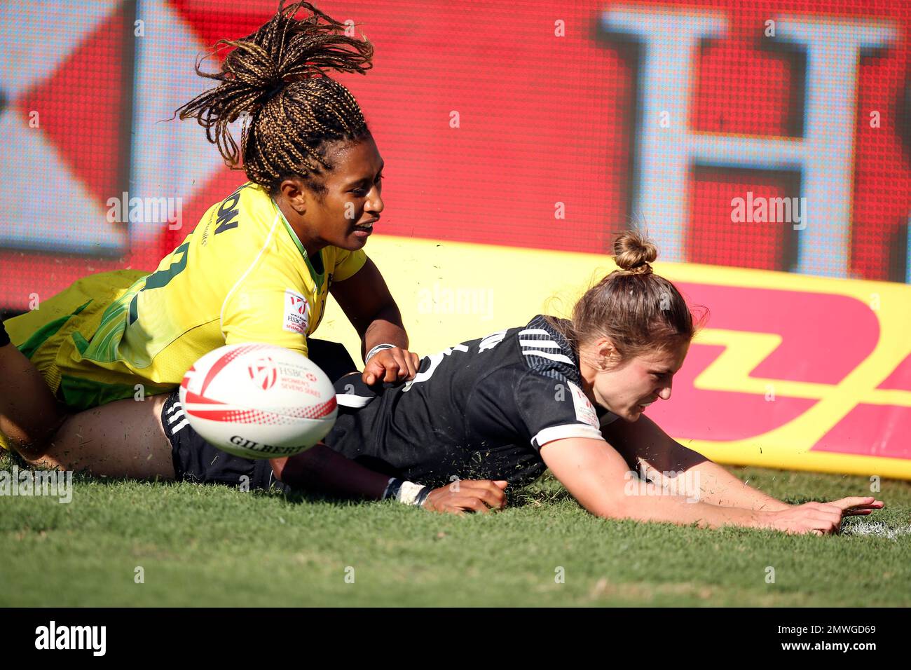 New Zealand's Michaela Blyde, right, scores a try despite the effort of ...