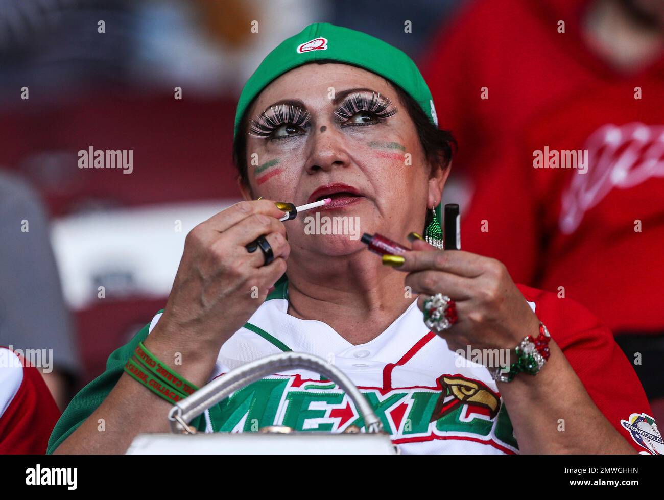 In this Wednesday, Feb. 1, 2017 photo, a Mexican baseball fan touches ...