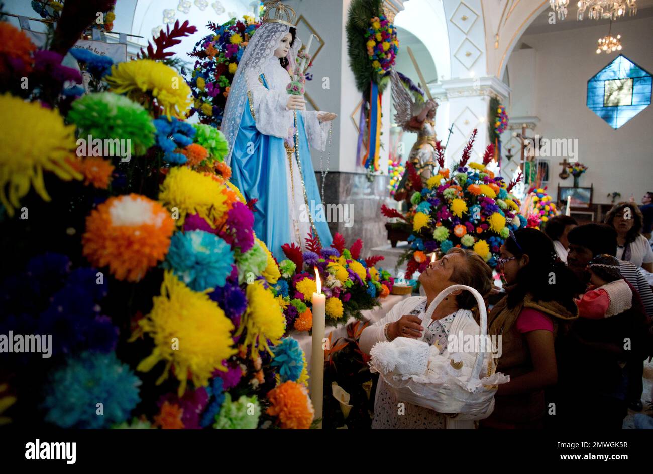 Faithful pray during the Feast of the Virgin of Candelaria in Mexico ...