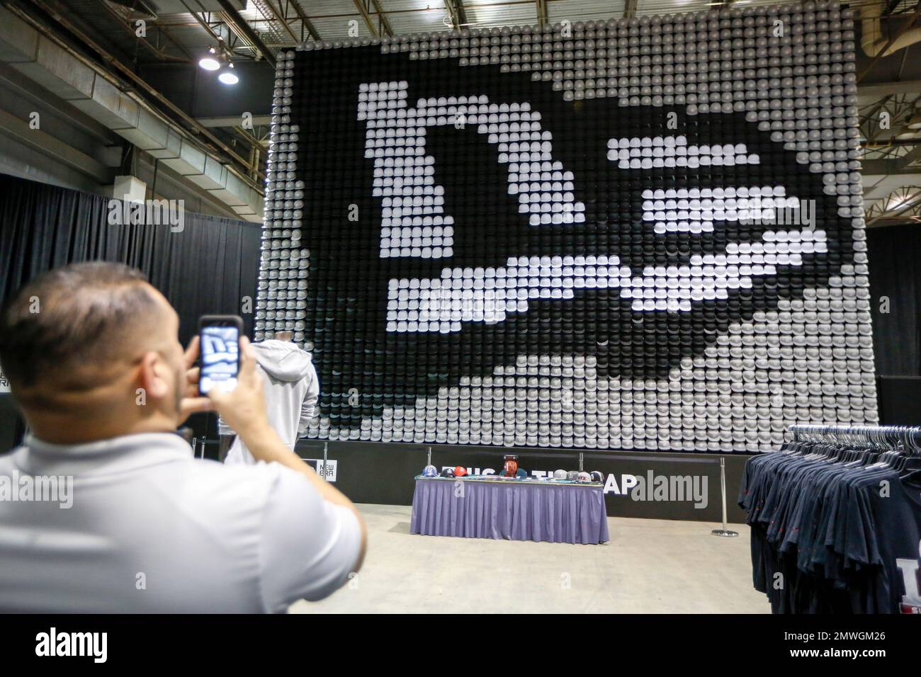 IMAGE DISTRIBUTED FOR NEW ERA CAP - A man photographs the Guinness Book ...