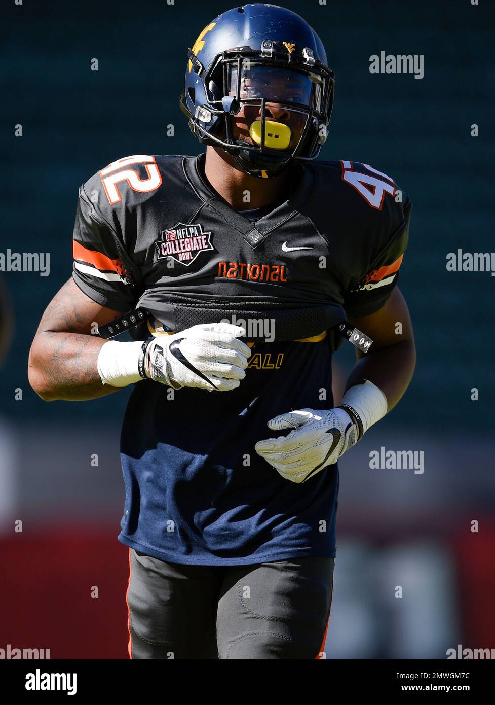 National Team defensive back Jeremy Tyler, of West Virginia, warms up ...