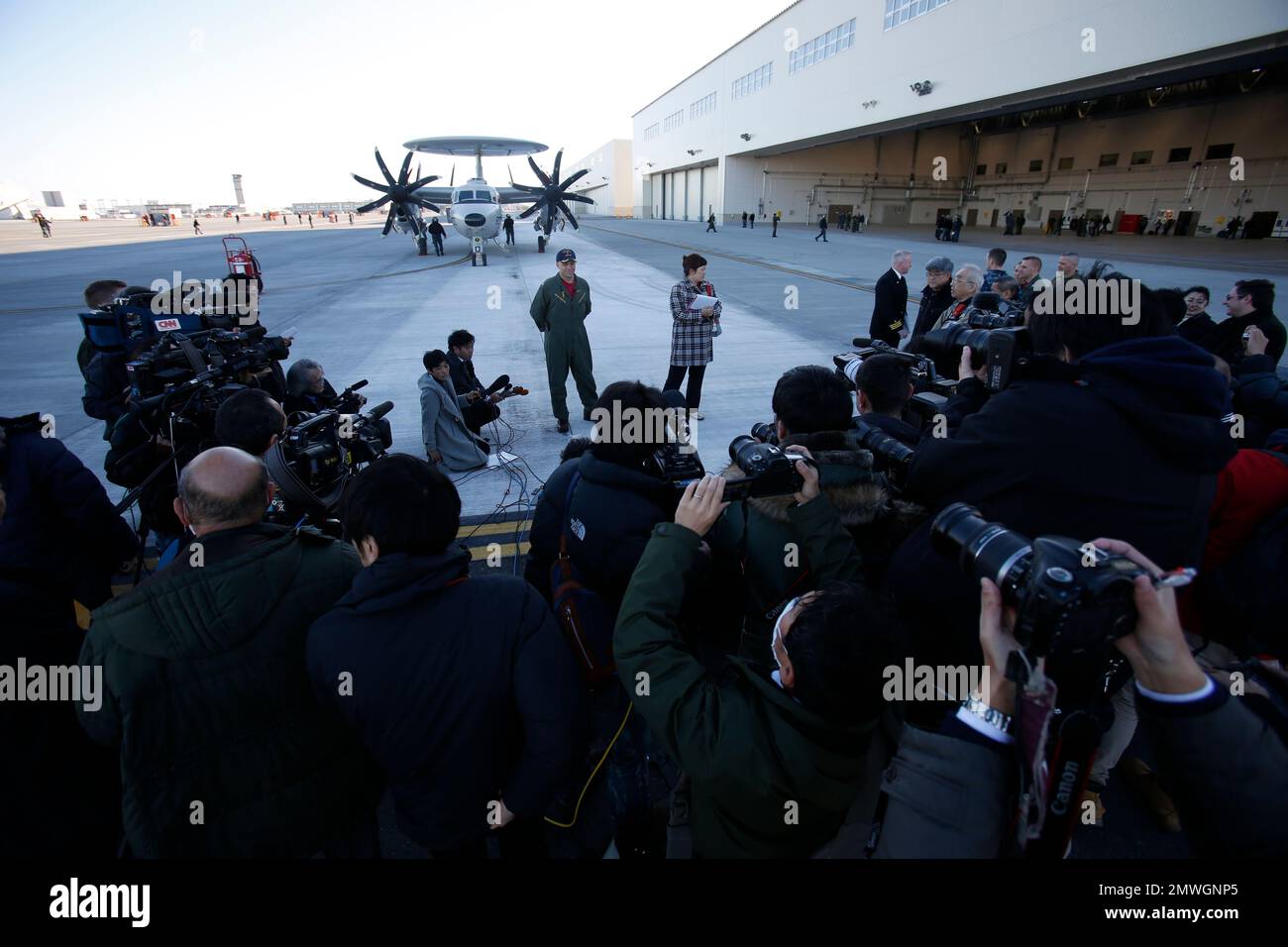 Cmdr. Daniel Prochazka, U.S. Navy Commanding Officer, center, talks to ...