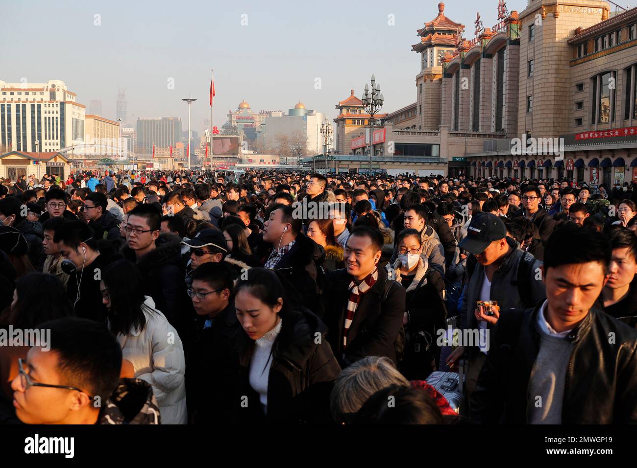 Passengers crowd at subway main entrance outside the Beijing railway ...
