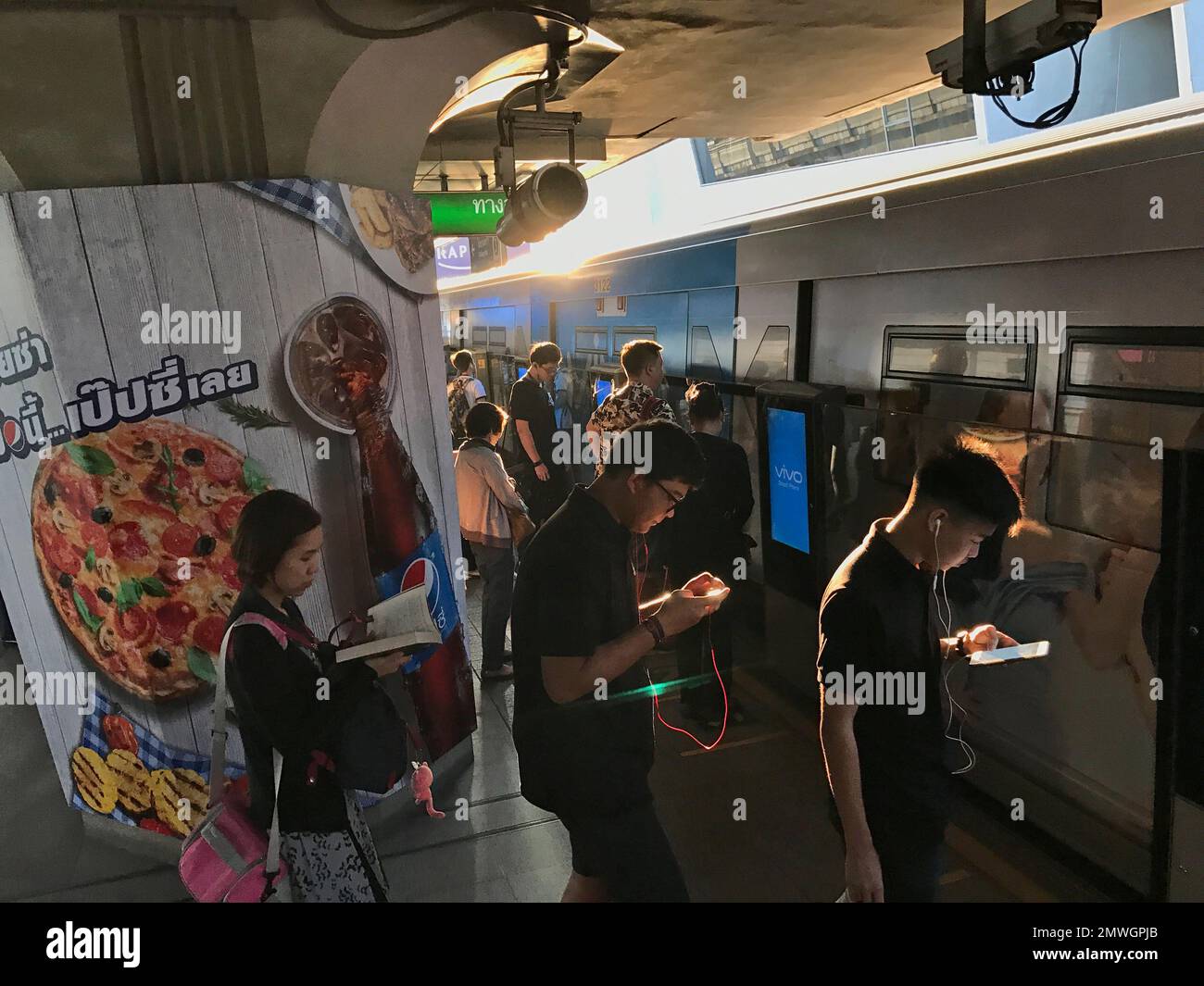 In this Sunday, Jan. 22, 2017, photo, commuters wait to board the BTS ...