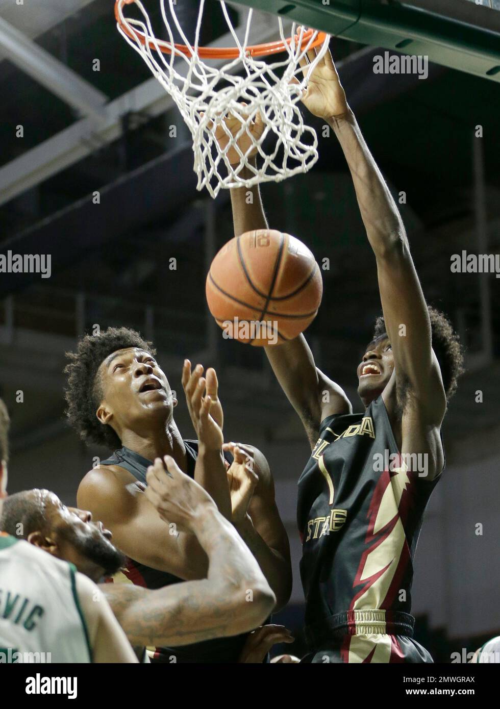 Florida State forward Jonathan Isaac (1) dunks against Miami in the ...