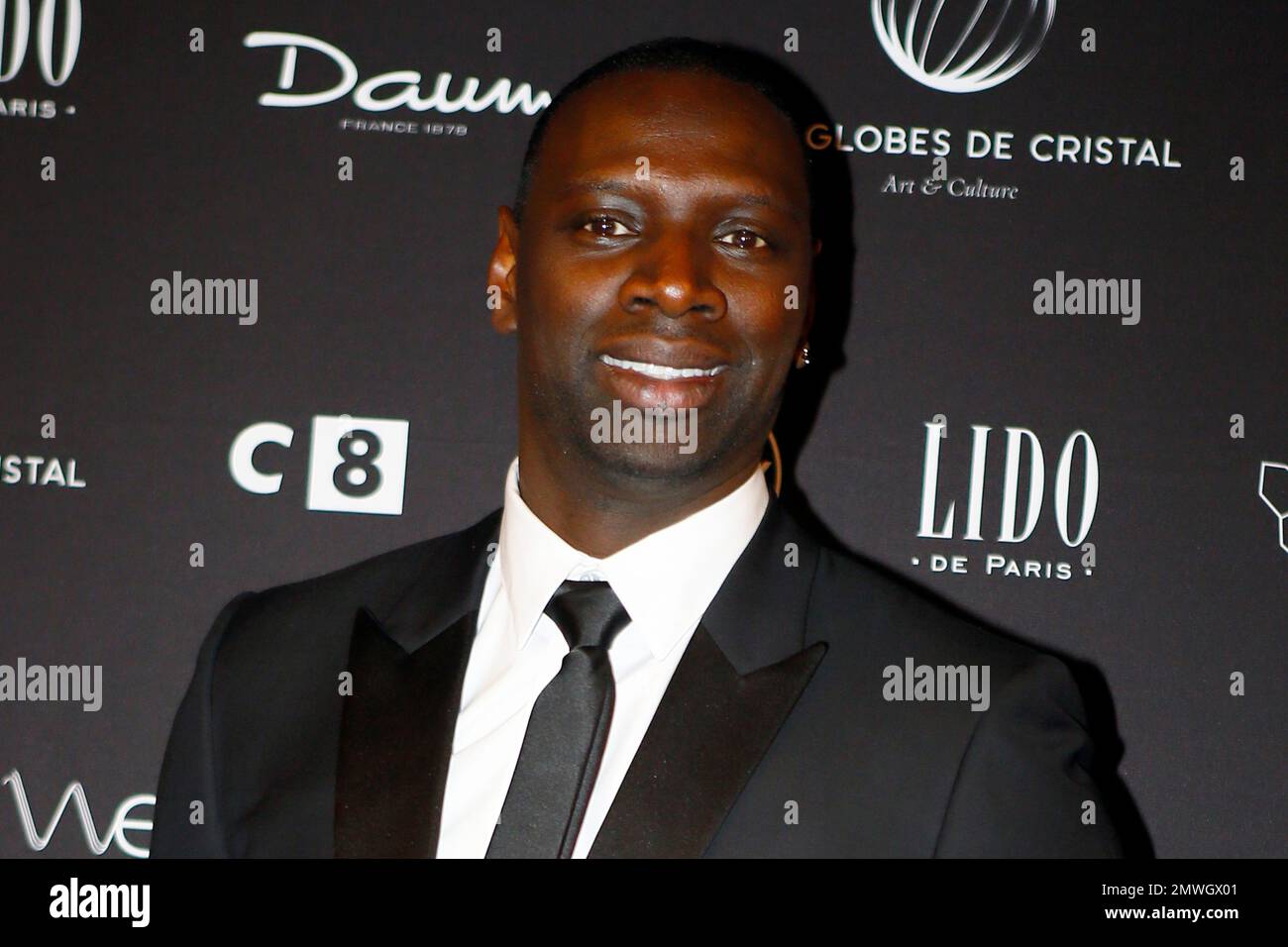French actor Omar Sy poses during a photo call at the Lido cabaret on ...
