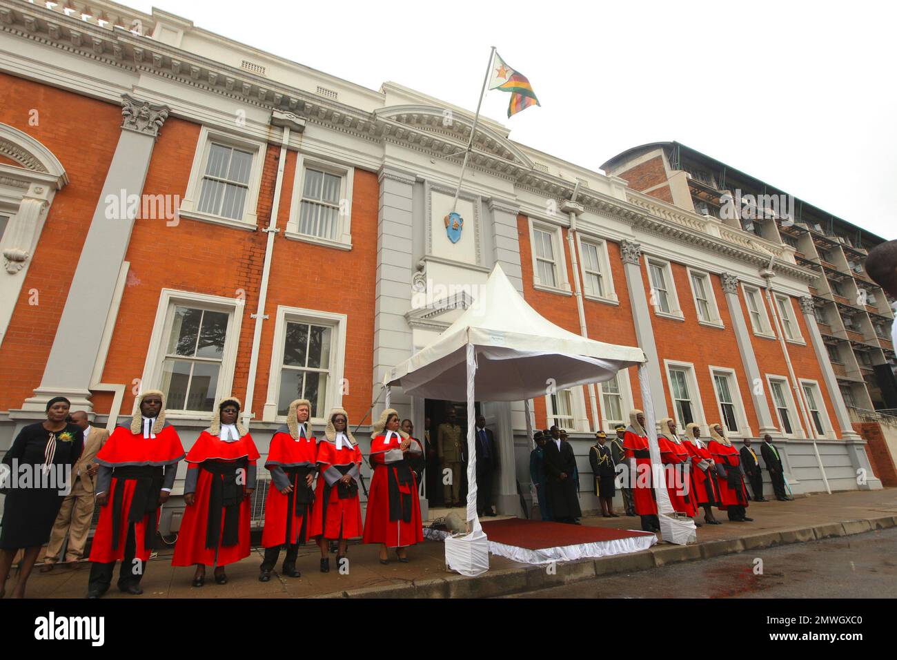 Zimbabwean judges in long red robes and horsehair wigs, a throwback to ...