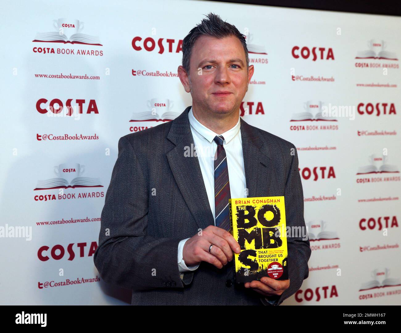 Author Brian Conaghan holds up his book 'The Bombs that Brought us ...