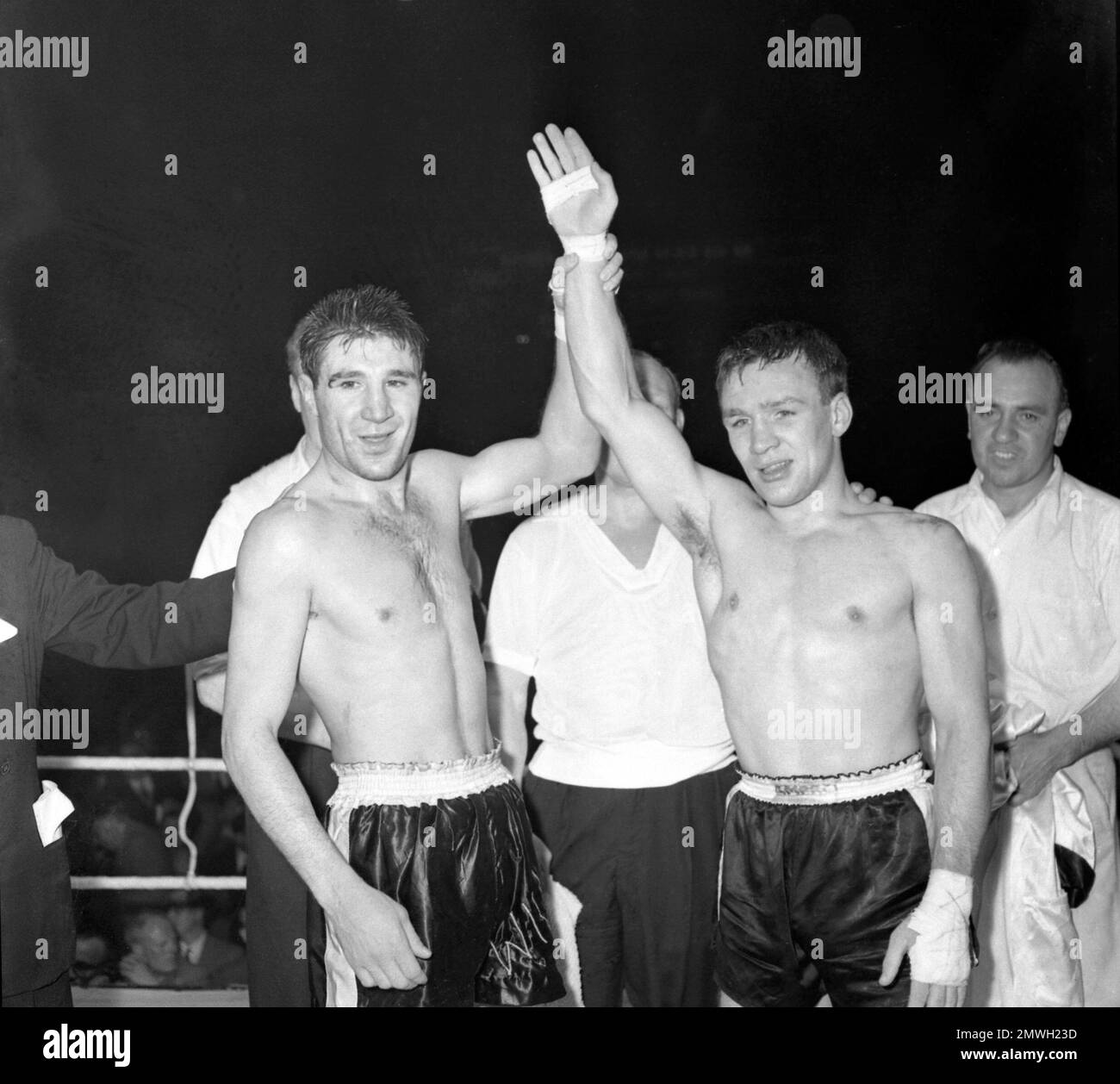 Willie Toweel, left, holds up the arm of Dave Charnley, England, after ...