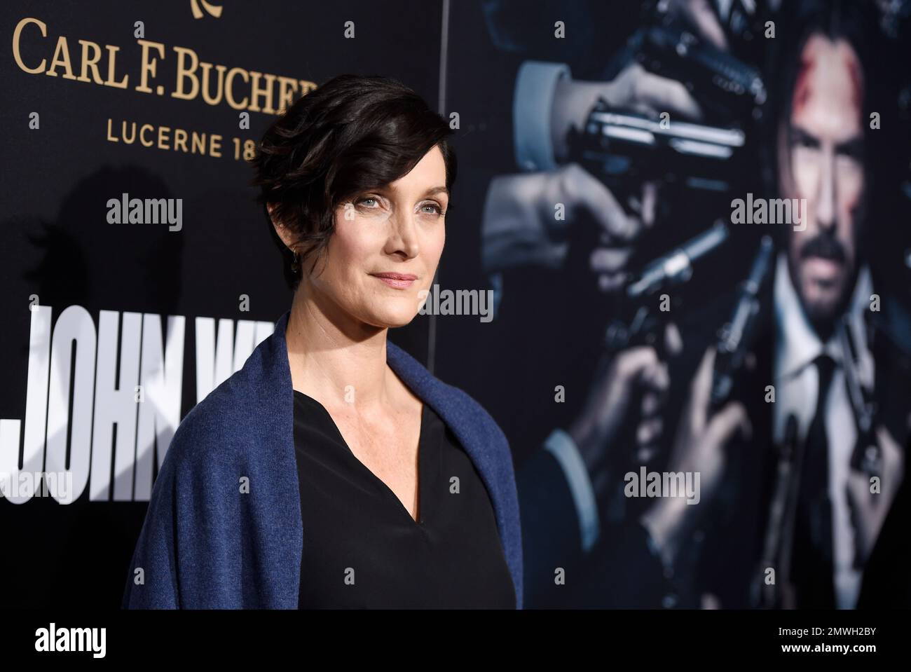 Actress Carrie-Ann Moss poses at the premiere of the film "John Wick ...