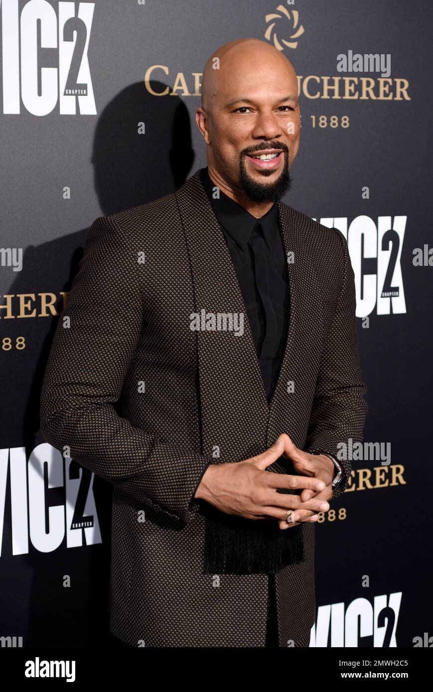 Common, a cast member in "John Wick: Chapter 2," poses at the premiere ...