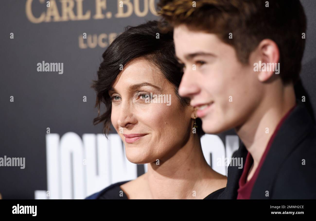 Actress Carrie Ann Moss Poses With Her Son Owen At The Premiere Of The Film John Wick Chapter